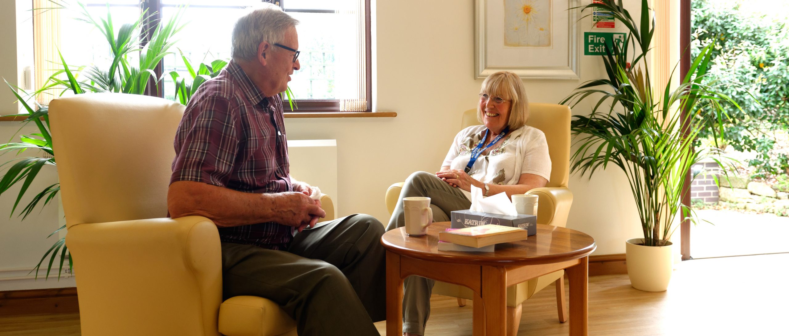 Staff clinician talking with patient - St Barnabas Hospice