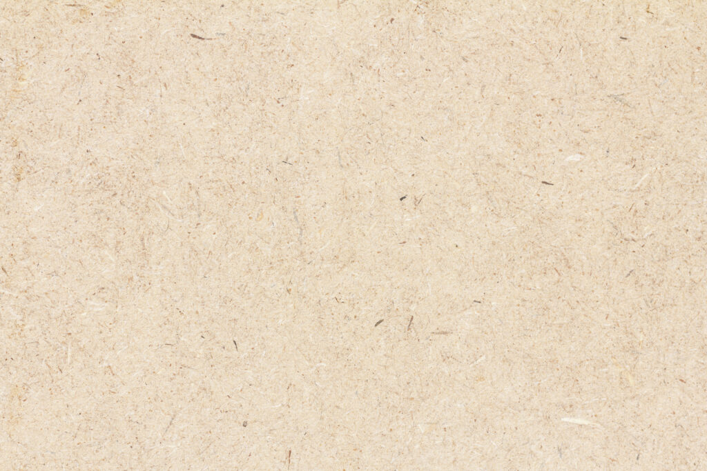 Pressed beige chipboard texture. Wooden background. - St Barnabas Hospice